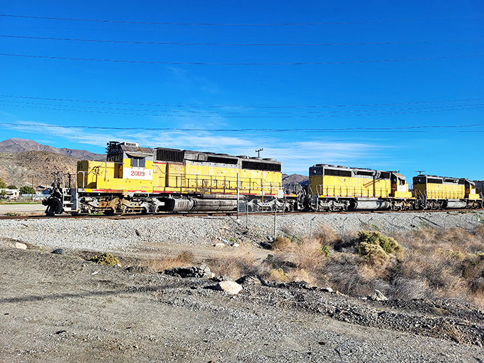 The yellow lifeline—Trona Railway's locomotives connect this isolated community to the wider world, hauling the minerals that give the town purpose.