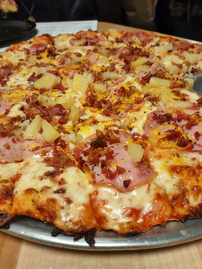 Hawaiian pizza skeptics, prepare to be converted – this sweet-savory masterpiece makes pineapple-on-pizza debates seem like wasted breath.