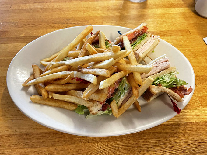 The club sandwich&mdash;architecture you can eat! Layers of turkey, bacon, fries and fresh veggies create a skyscraper of flavor that's worth every napkin.