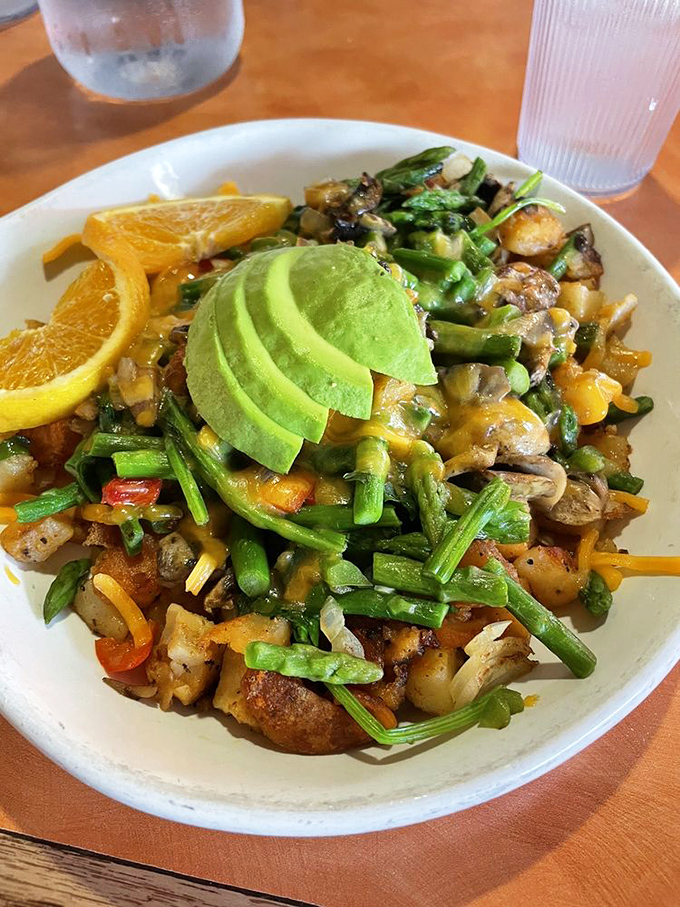 Vegetable hash that makes eating healthy feel like cheating. That sliced avocado is practically winking at you from across the plate.