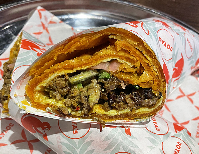 The Kati Roll: where Indian street food meets Ohio morning hunger. That golden exterior promises a flavor explosion waiting to happen.