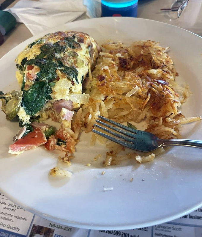 The veggie omelet that convinced carnivores to make room on their plate for spinach. Those hash browns deserve their own fan club.