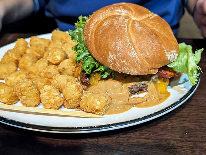 Not just a burger&mdash;a commitment. Those tater tots are the unsung heroes, waiting patiently for their moment in the spotlight.