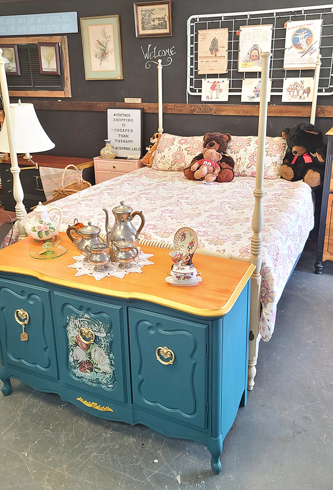 A bedroom vignette that whispers, "Your IKEA furniture will never have this much character," complete with teddy bears judging your decorating choices.