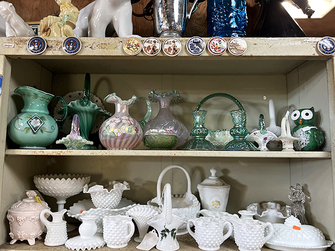 Delicate vintage glassware and milk glass treasures whisper tales of elegant dinner parties from decades past, waiting for new homes.