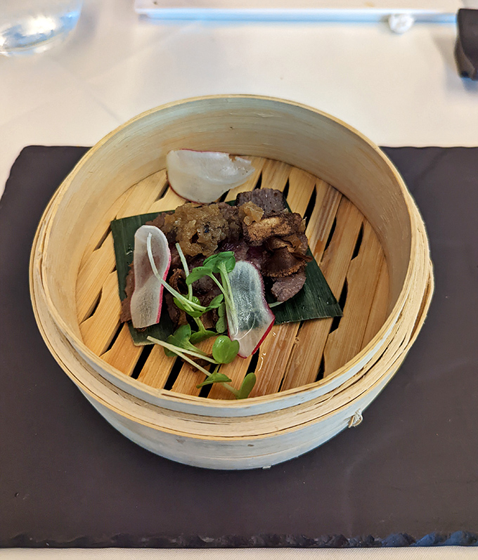 Kagoshima A5 Wagyu presented in bamboo steamer - when beef reaches art gallery status, traditional presentation becomes pure poetry.