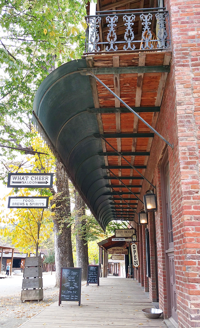 The curved wooden awnings of What Cheer Saloon create a shaded boardwalk perfect for sipping sarsaparilla and watching the world go by at Gold Rush pace.
