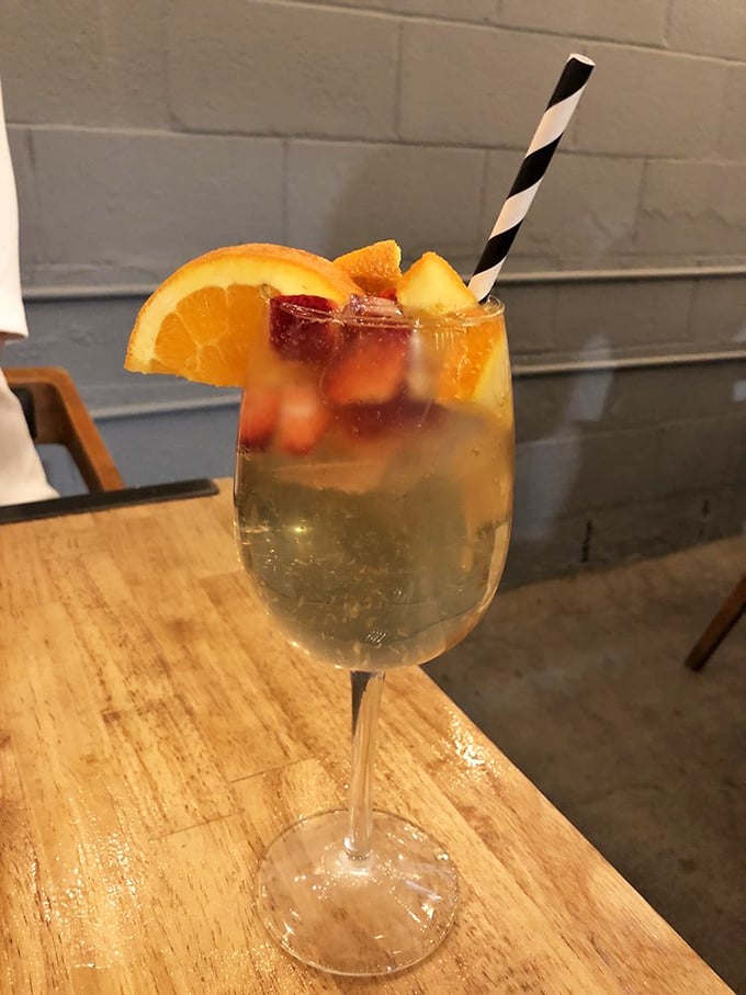 A sangria that tastes like vacation in a glass, garnished with enough fresh fruit to almost count as a serving of your daily produce.