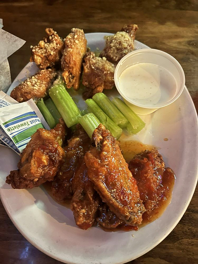 Wings that strike the perfect balance between crispy exterior and juicy interior. The sauce glistens with promises it fully intends to keep.