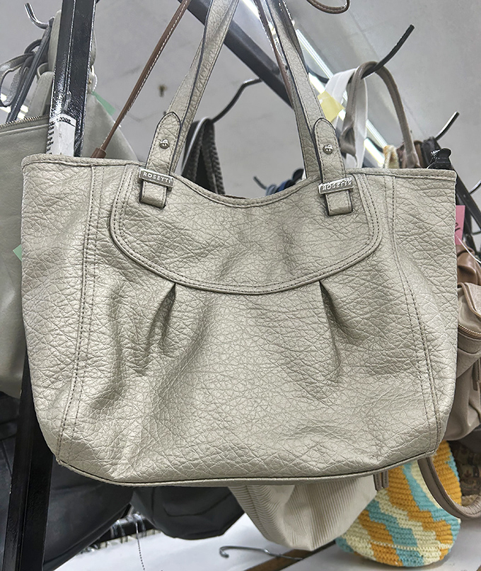 Designer bags without designer prices. This cream leather tote has plenty of life left for carrying your essentials in style.