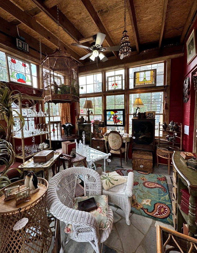 This sunlit corner showcases wicker furniture and stained glass, perfect for imagining lazy Sunday afternoons from another century.