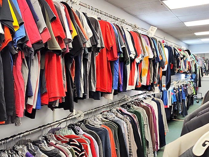 The clothing section stretches like a textile rainbow, each hanger holding possibilities for reinvention or that perfect vintage find your friends will envy.