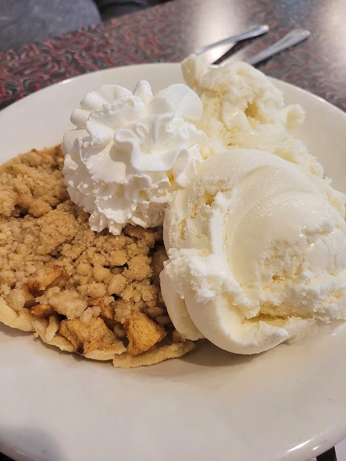Apple pie &agrave; la mode: America's dessert ambassador. Two scoops of vanilla ice cream creating the perfect hot-cold romance with that crumbly crust.