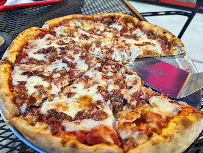 Meat lover's pizza that doesn't whisper its intentions&mdash;it announces them with a chorus of perfectly crisped bacon atop that beautiful cheese canvas.