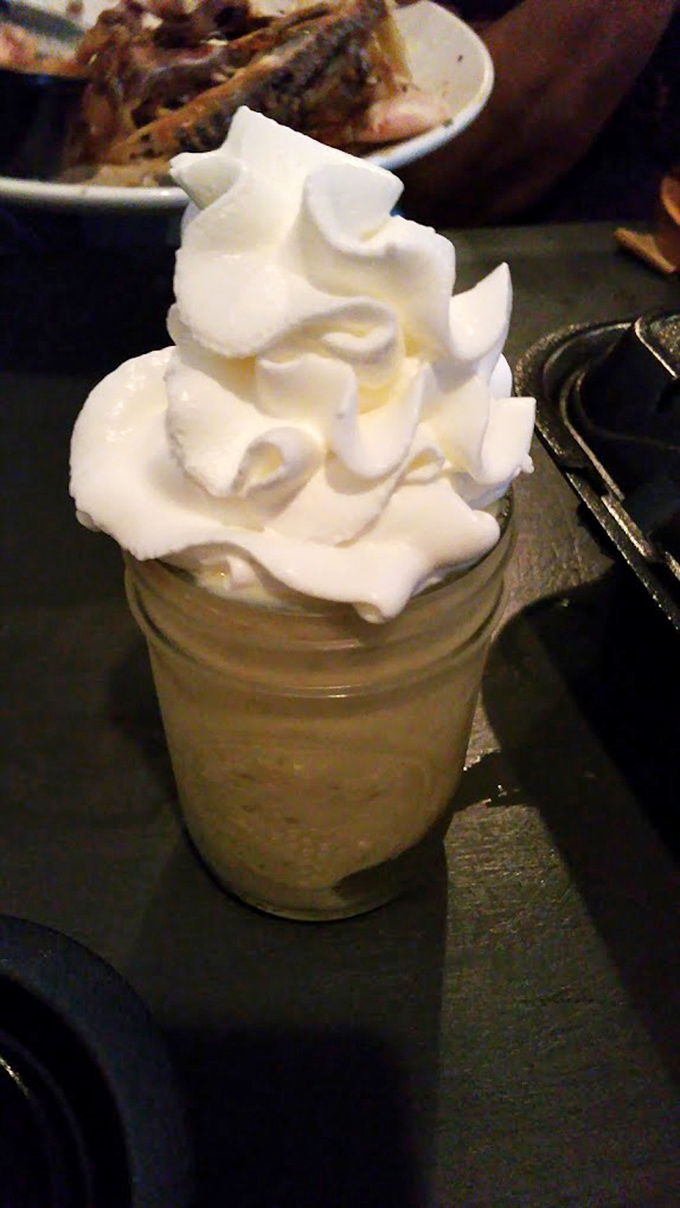 Mason jar banana pudding topped with a cloud of whipped cream. Grandma's recipe got a hipster makeover, and somehow everyone's happy about it.