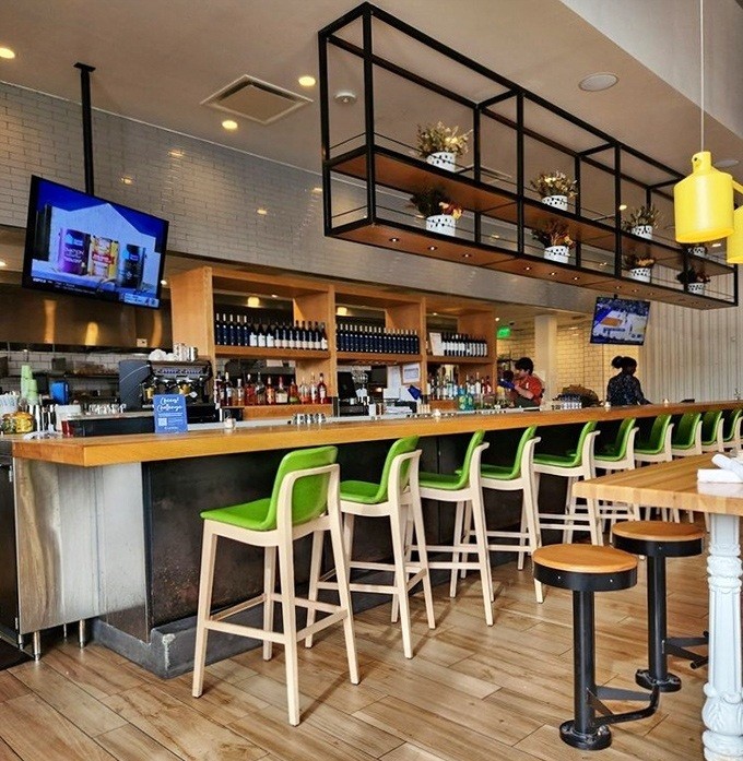 The bar area invites you to perch on those cheerful green stools and sip something that's both virtuous and delicious&mdash;a rare combination indeed.