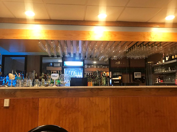 The bar area stands ready for thirsty travelers, where sea stories get better with each round of drinks.