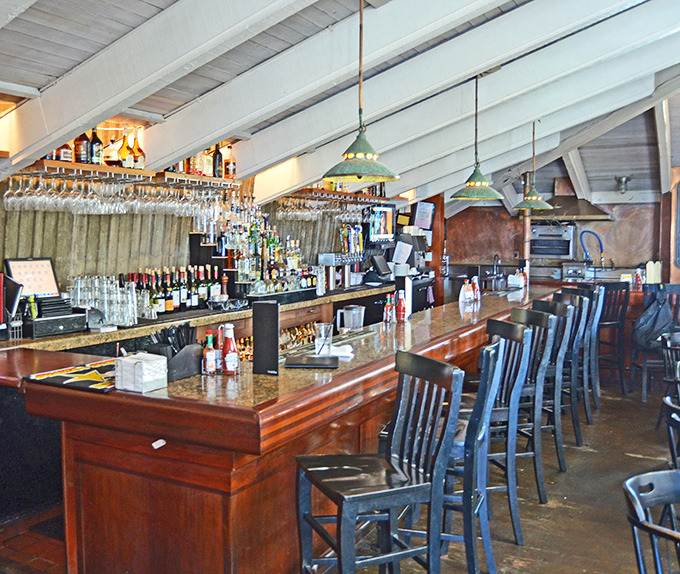 The bar area balances rustic charm with coastal sophistication &ndash; where locals and tourists alike discover that seafood tastes better with a side of ocean breeze.