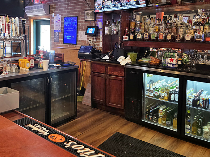 The bar area—where strangers become friends and friends become regulars. Those bottles aren't just spirits; they're conversation starters.
