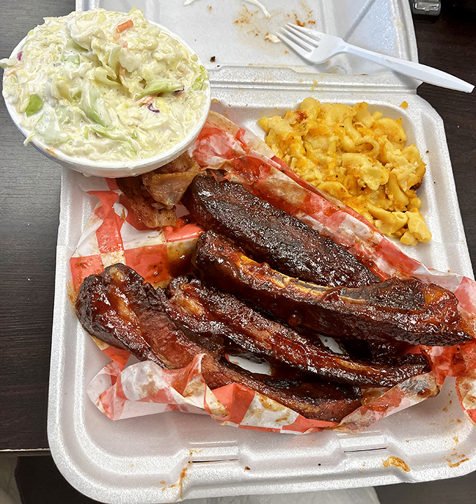 Ribs with the perfect smoke ring, mac and cheese that means business, and collard greens that would make a Southerner nod in approval.