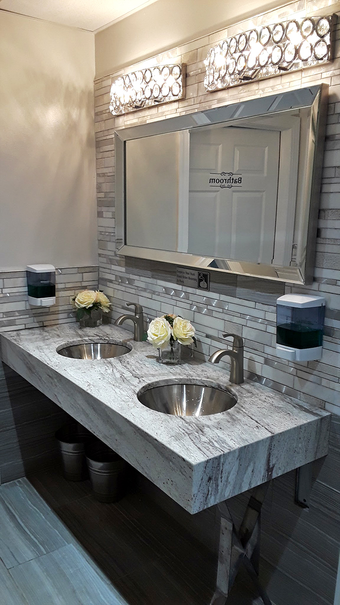Even the restroom gets the royal treatment with elegant lighting, marble countertops, and fresh flowers&mdash;unexpected luxury in a family restaurant.