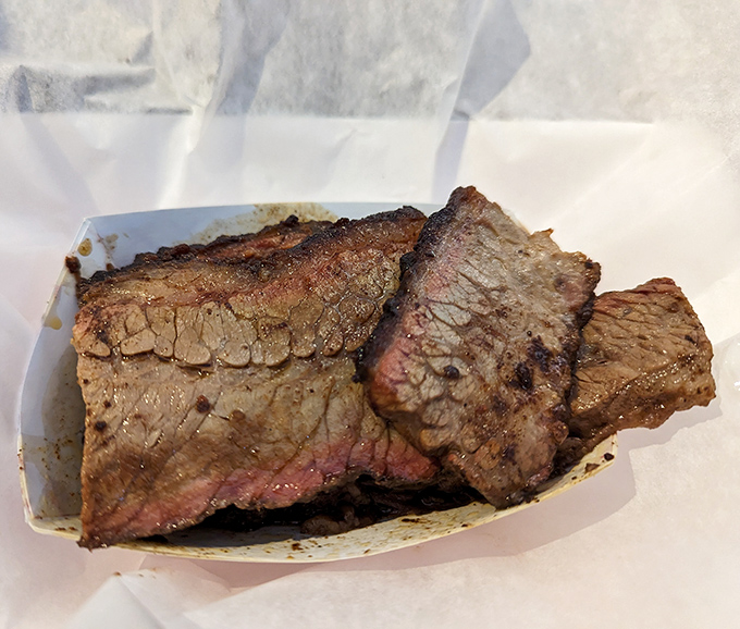 Brisket with a smoke ring so perfect it could be framed. Each slice tells a story of patience and pit mastery.