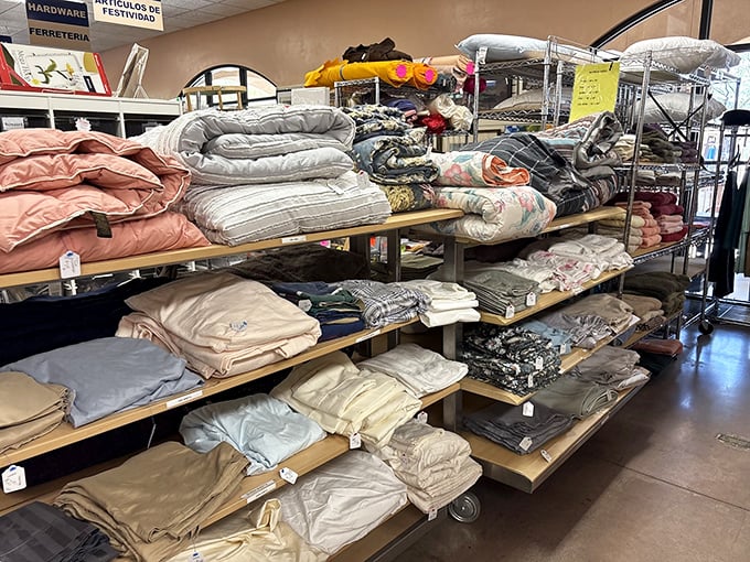 Bedding and linens stacked with military precision. Someone's redecorating whim becomes your guest room upgrade at a fraction of department store prices.