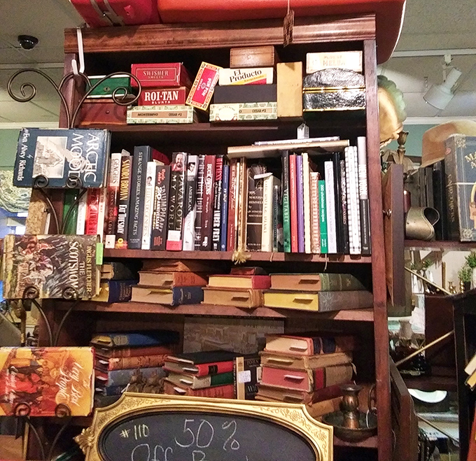 A bibliophile's dream corner where vintage cigar boxes meet leather-bound classics &ndash; proof that books were meant to be both read and displayed.