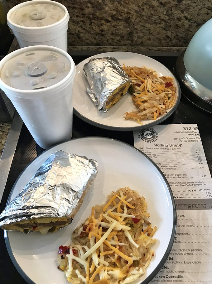 Wrapped in foil like the precious gift it is – Charann's breakfast burrito comes with a side of cheesy hash browns.