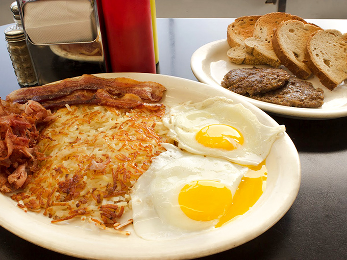 Breakfast done right: crispy hash browns, perfectly cooked eggs, and bacon that would make any morning worth getting up for.
