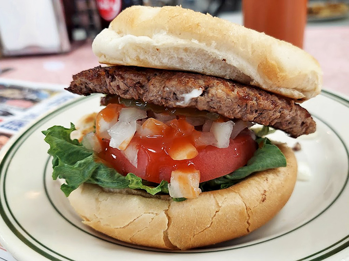 This burger towers with pride, proving that sometimes bigger really is better when done with skill.