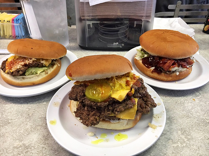 A burger trinity that proves good things come in threes, especially when they're surrounded by soft buns and melty cheese.