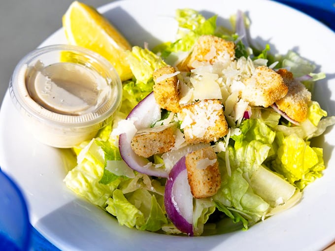 A Caesar salad that knows its role&mdash;bringing just enough green to the table without stealing the seafood spotlight.