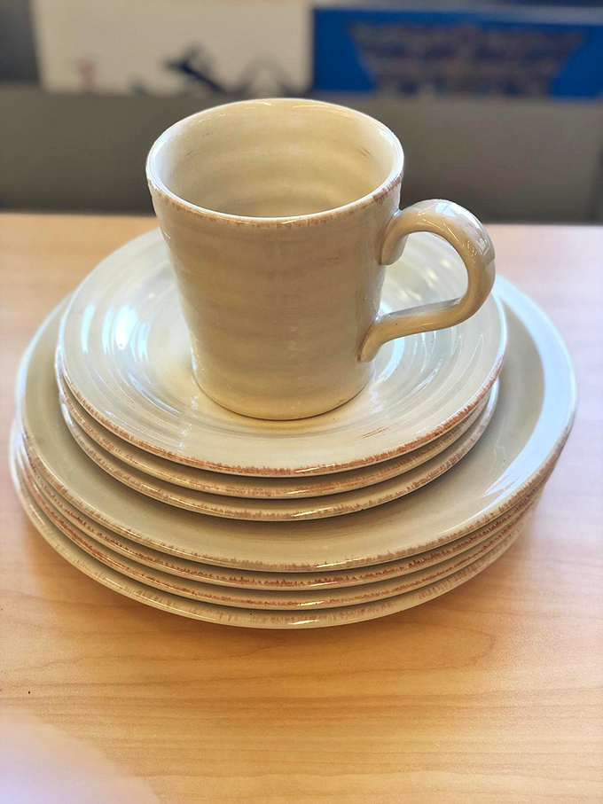 Mismatched perfection&mdash;this cream ceramic dishware set proves that sometimes the most charming table settings come from thrift store shelves, not wedding registries.