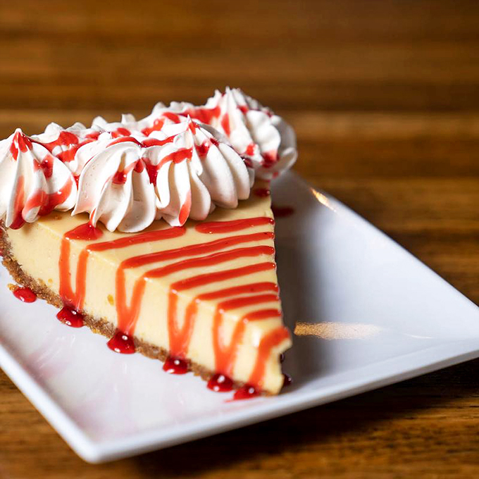 Cheesecake with strawberry drizzle that would make The Golden Girls abandon Miami for Fort Myers. Creamy, dreamy, and worth every calorie.