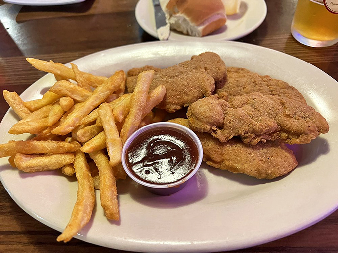 Chicken tenders and fries that remind you why sometimes the simplest pleasures are the most satisfying. Comfort food, perfected.