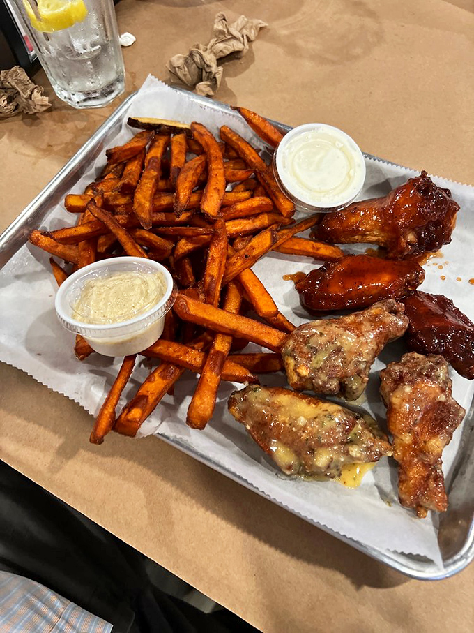 Wings and sweet potato fries that make you question why you'd ever eat anything else. Two dipping sauces because life is about choices.