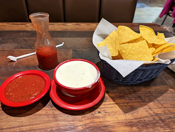 The holy trinity of Mexican restaurant starters: warm chips, fresh salsa, and queso that stretches with each dip like it's auditioning for a cheese commercial.