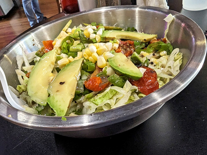 A vibrant chopped salad that proves healthy eating doesn't have to be punishment. Those avocado slices are practically winking at you.