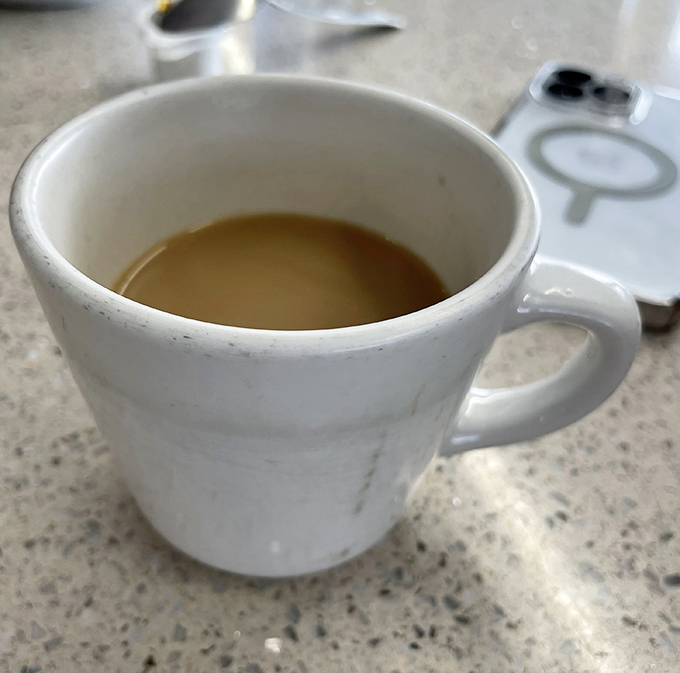 The humble diner coffee cup&mdash;where caffeine meets function in a ceramic vessel that's witnessed countless morning conversations.