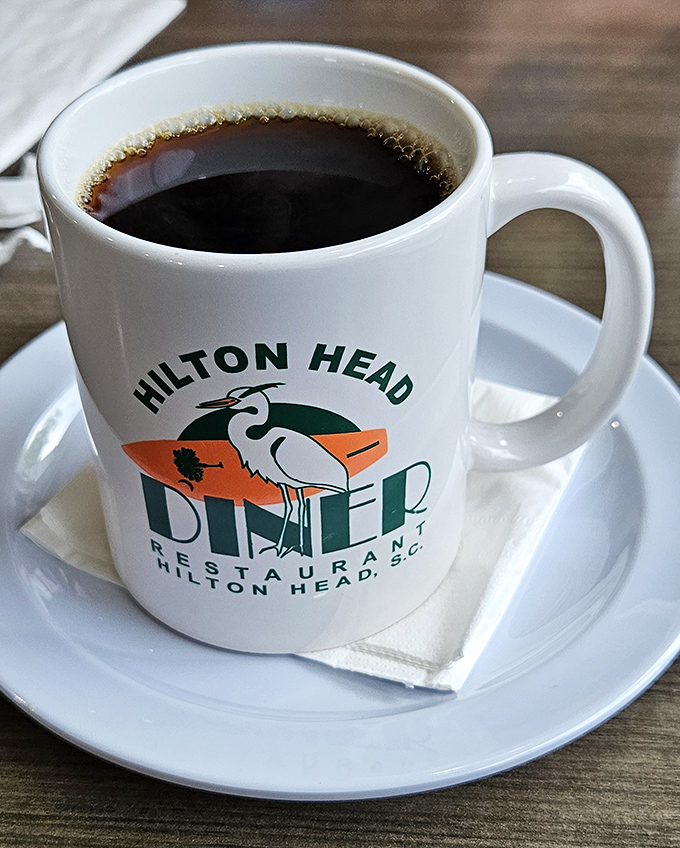 Coffee served in a mug that means business, emblazoned with the diner's iconic logo&mdash;because serious breakfast requires serious caffeine.