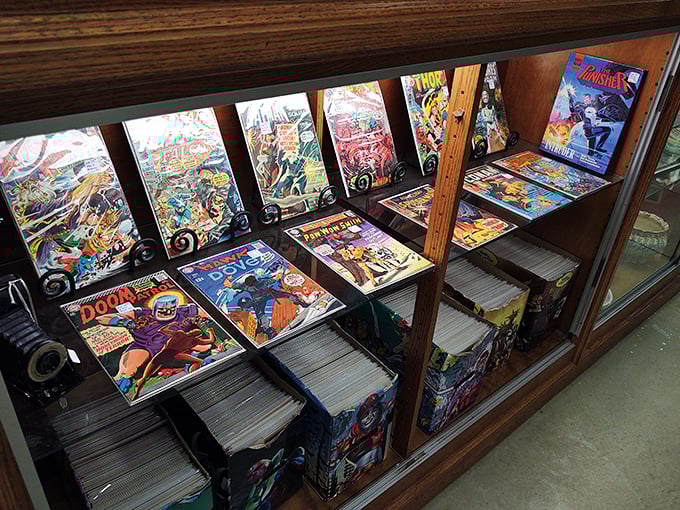 Behind glass, superheroes wait in suspended animation, their four-color adventures preserved for collectors who remember when comics cost just 12 cents.