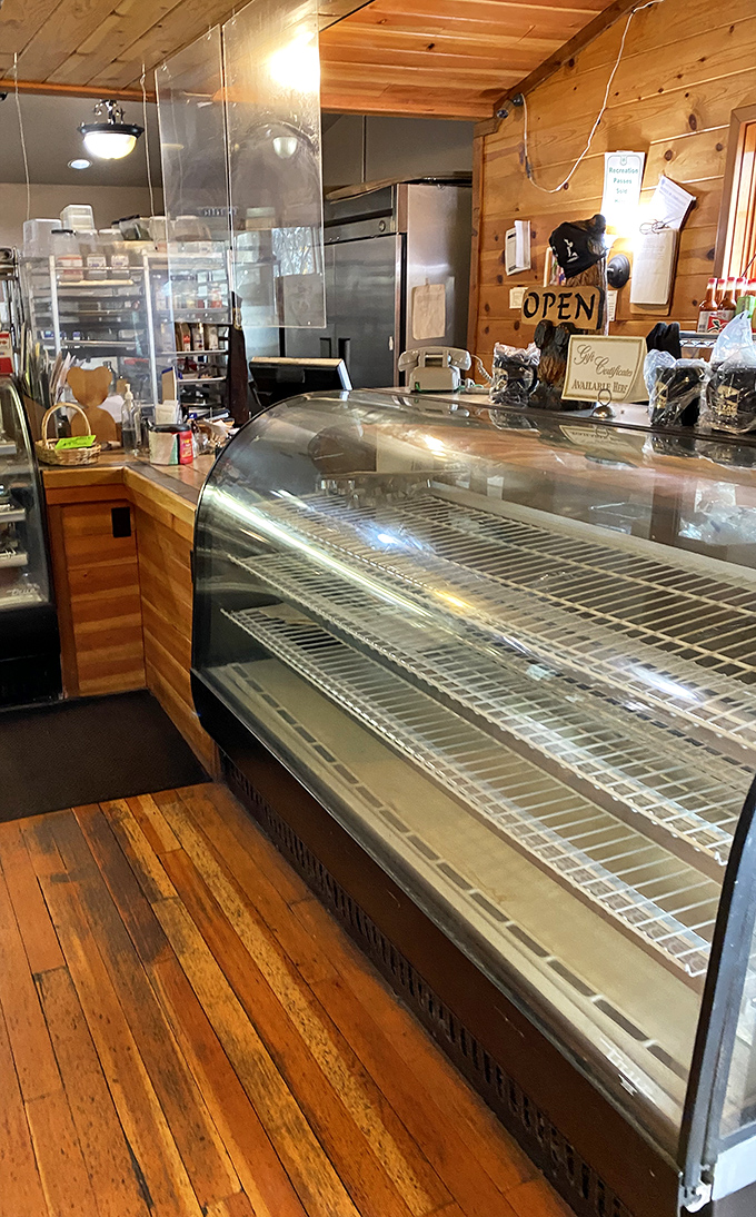 Behind the counter, where culinary magic happens &ndash; empty display cases just mean everything's fresh and probably already on someone's happy plate.