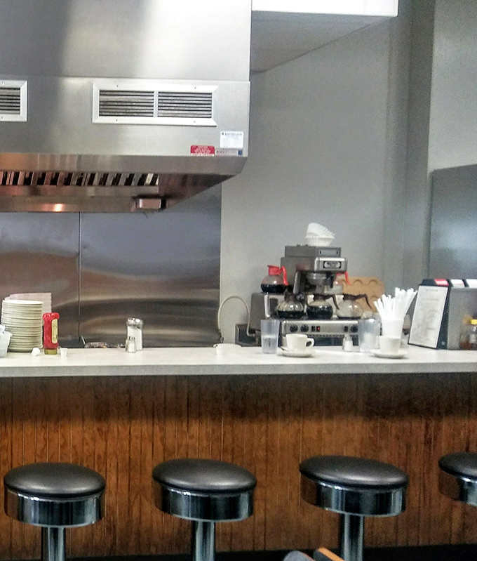 Counter seating: where the real diner magic happens. Watch your breakfast being made while eavesdropping on conversations that are better than any podcast.