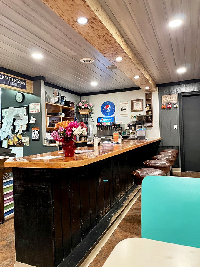 The counter where magic happens. Wood paneling, fresh flowers, and a soda fountain that's seen generations of Centre County stories unfold.