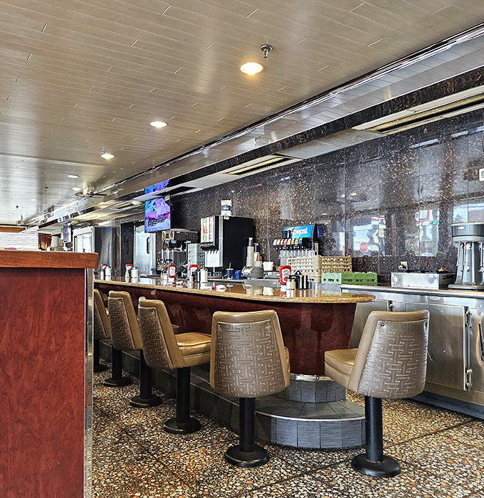 The counter seating&mdash;where solo diners become regulars, and the coffee refills flow as freely as the conversation with your favorite server.