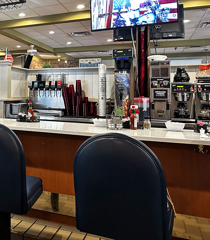 The counter seating area&mdash;where coffee magic happens and breakfast dreams come true. Those coffee machines have witnessed countless morning revelations.