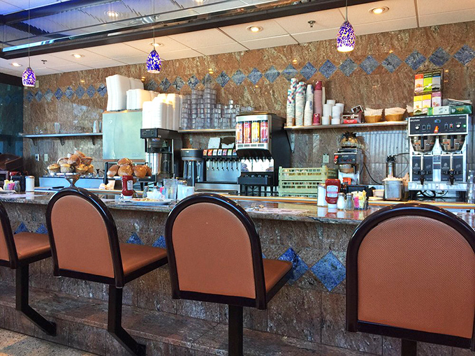Counter seating where you can watch breakfast magic happen while sipping your morning fuel properly.
