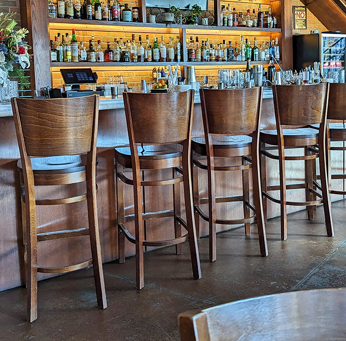 The bar's wooden chairs practically beg you to settle in for an evening of wine, conversation, and "just one more small plate."