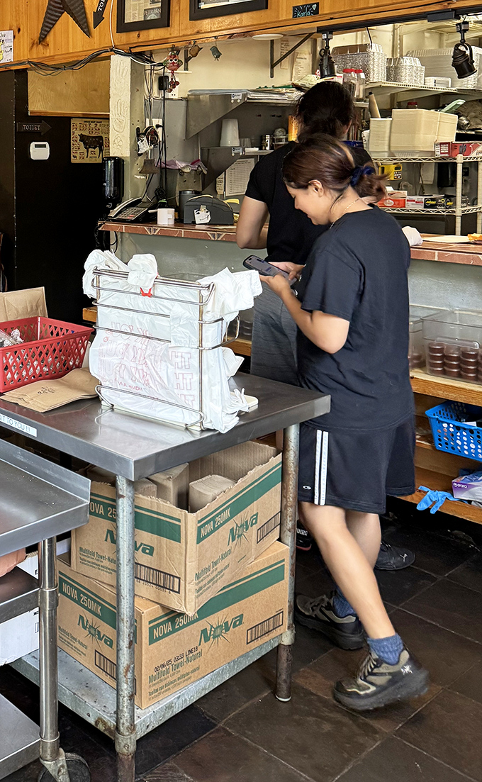 The kitchen crew in their element &ndash; where barbecue magic happens with military precision and artistic flair.